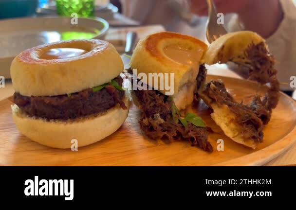 Eating traditional Spanish brioche buns with oxtail starter in Bibo ...