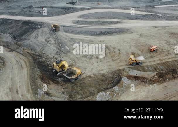 Excavator loads ore dump trucks Stock Videos & Footage - HD and 4K ...