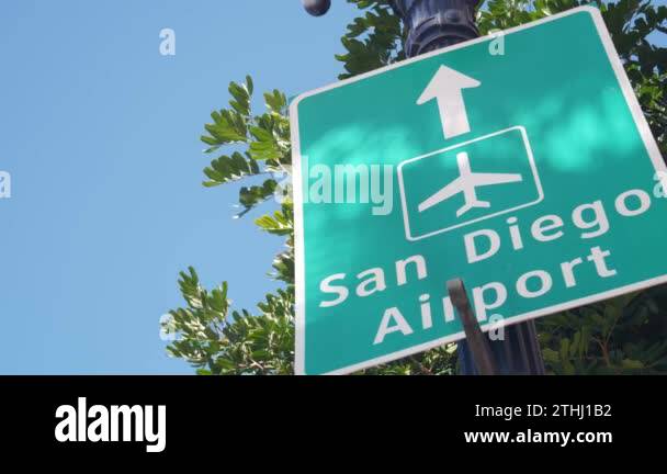 Airport green road sign with direction arrow and plane icon, San Diego ...