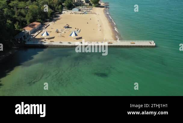 Large suburban public beach in Glencoe, Illinois with long pier along ...