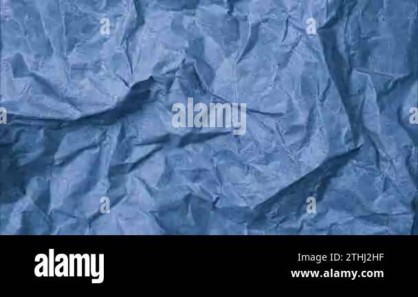 Video Top view of wrinkled textured paper. Blue crumpled paper texture ...