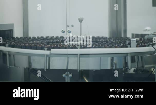 Manufacturing line at medical factory. Robotic arm put medicine package ...