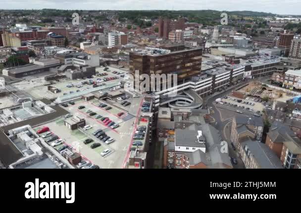 Aerial view high angle footage of modern car park in the building and ...