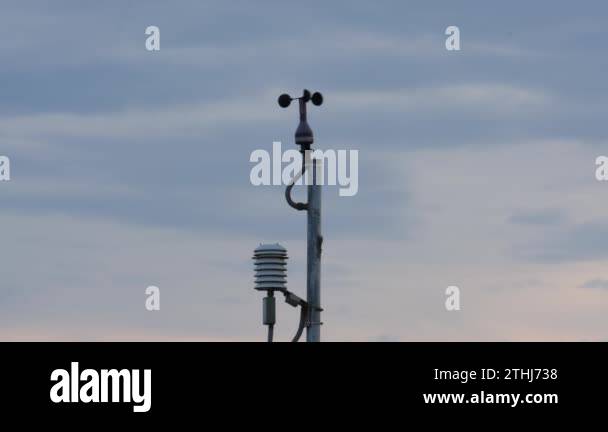 Weather station for measuring wind velocity. Anemometer on blue sky ...