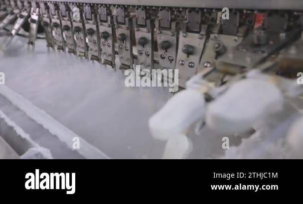 Freezing ice cream at the factory. Automatic production of ice cream ...