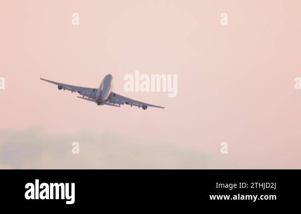 Widebody aircraft takeoff and climb, long shot. Rear view, a huge plane ... Widebody aircraft takeoff and climb, long shot. Rear view, a huge plane ...