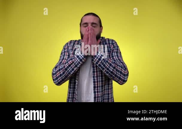 Mid adult bearded man sneezing, coughing, got cold flu virus ...