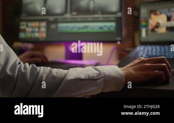Multimedia artist editing movie footage on post production software ...