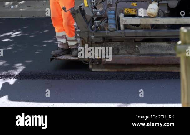 Replacing old asphalt when repairing the road surface. Asphalt paver ...