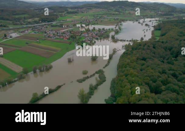 AERIAL: Rising water overflows river banks and approaches residential ...