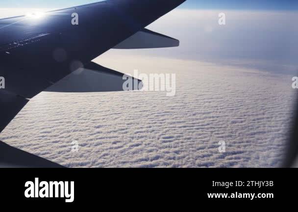 Close-up View Through Plane Window on Aircrafts Wing and Sea of White ...