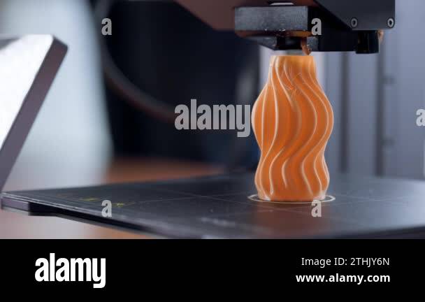 3D Printer, 3D Printing orange object. 4.0 industrial revolution ...