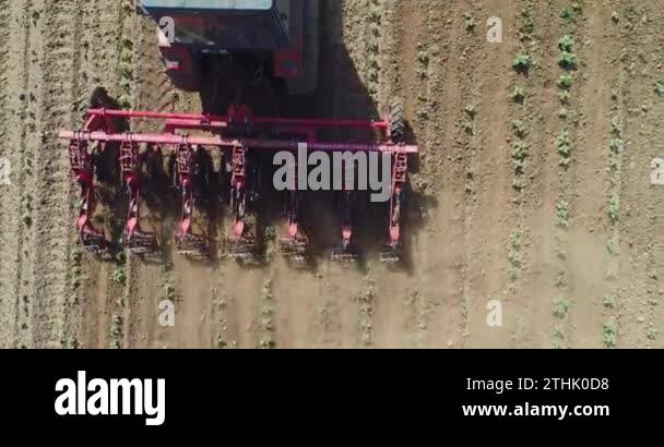 Tractor cultivating the ground in a agricultural field. Agronomy ...