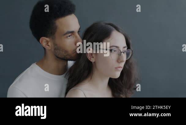 Loving young man whispering in girlfriends ear expressing feelings ...