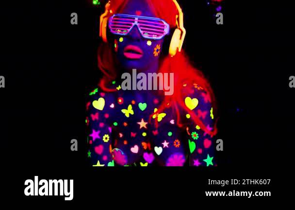 A mix of different images of a cyber raver dancer filmed in fluorescent ...