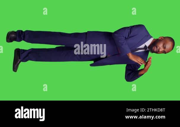 Vertical video: Side view of company worker showing timeout pause ...