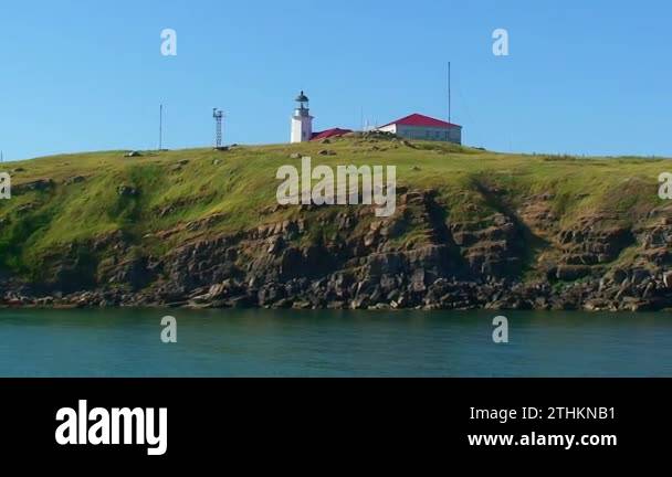 Snake Island in peacetime, sunny, the island is close, buildings and a ...