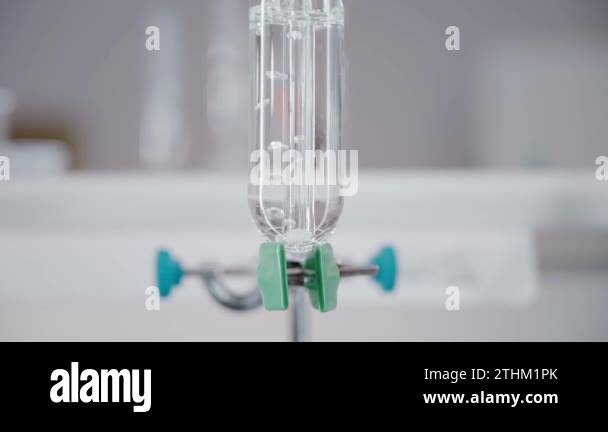 Boiling water in a glass flask. Bubbles. Close-up. Chemical reaction ...