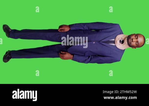 Vertical video: Front view of injured businessman wearing suit and ...