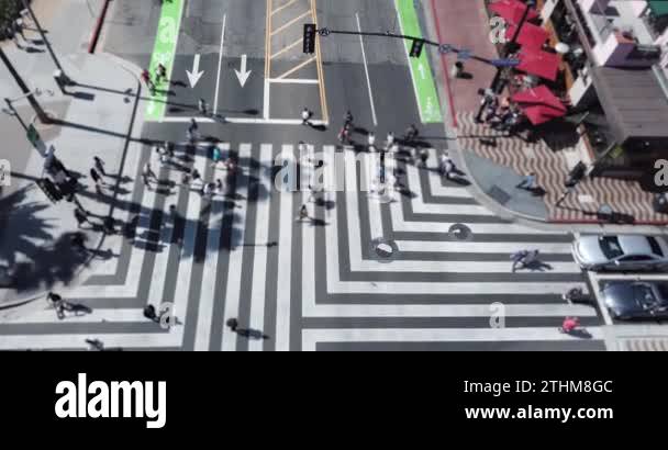 Unrecognizable pedestrians crossing at the beach through an ...