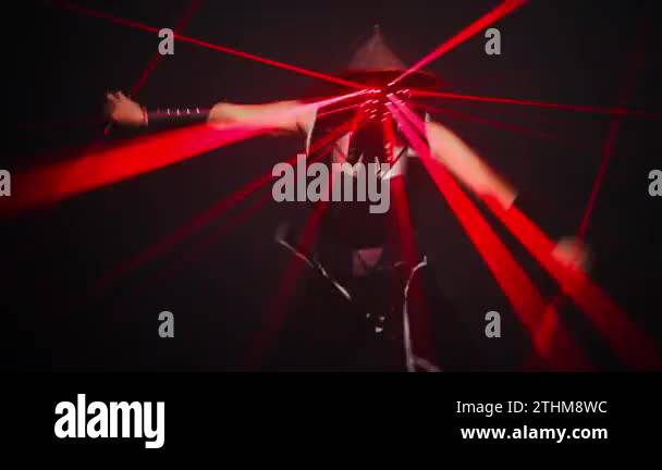 Professional male performer spinning dancing in samurai costume with ...