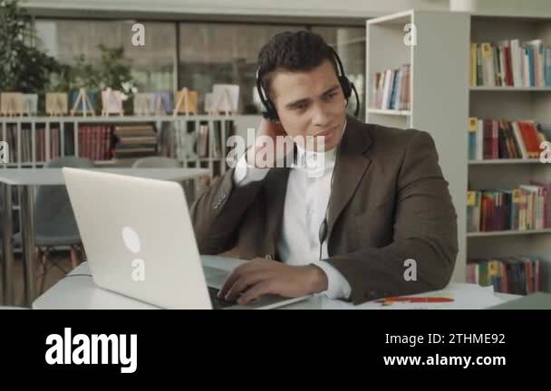 Young businessman in suit feels neck pain massaging tensed muscles ...