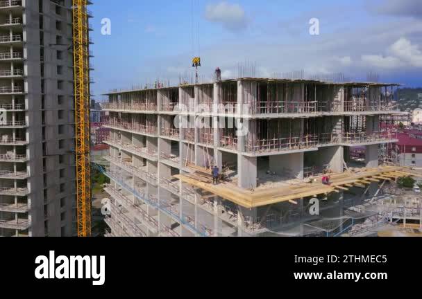 Large construction site of residential building with workers. Modern ...