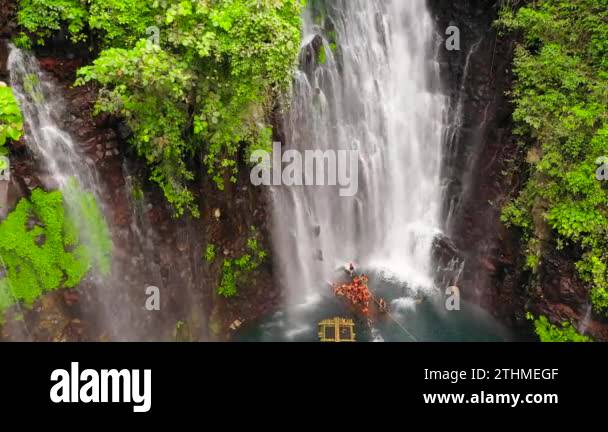 Aerial drone of Waterfall in the green forest. Tinago Falls in the jungle, island of Mindanao ...