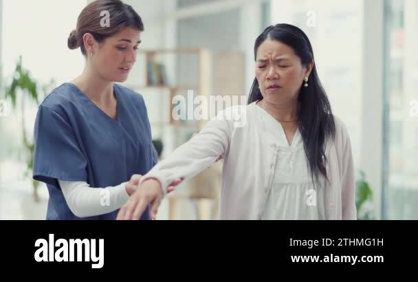 Physiotherapy, woman and client with pain, injury and recovery with ...