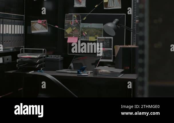 Evidence room office with detective board and desk, crime scene photos ...