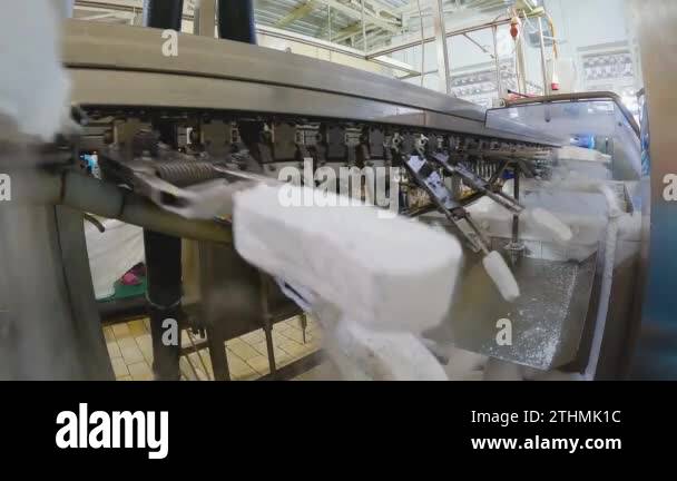 Freezing ice cream on the conveyor. Ice cream production process ...