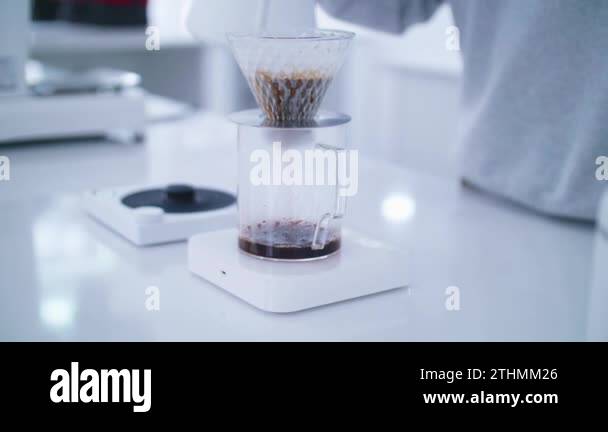 B roll shot Barista use hot pot process of brewing specialty coffee ...
