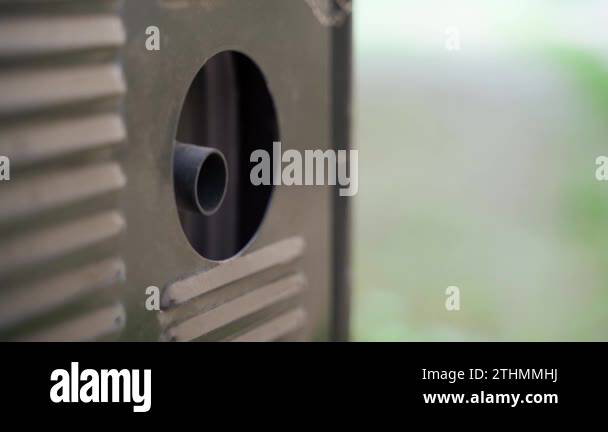 Exhaust pipe of a gasoline electric generator close-up during engine ...
