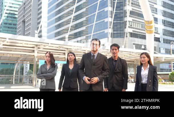 Group of business people asian team partners walking in city happy ...