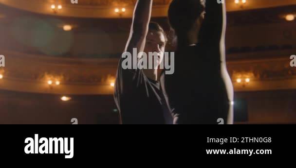 Beautiful ballet dancers practice and rehearse choreography on classic ...