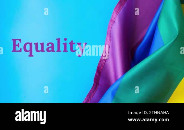 4k zoom in out Rainbow flag with text EQUALITY message. Rainbow lgbtq ...