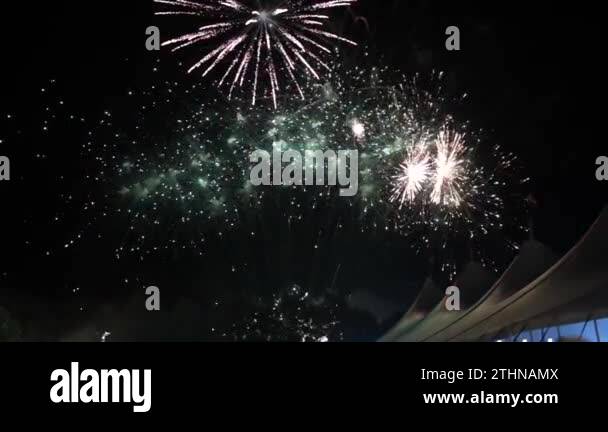 4K. loop seamless of real fireworks background. abstract blur of real ...