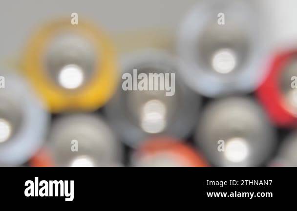 Different types of accumulators and batteries rotate on the turntable ...