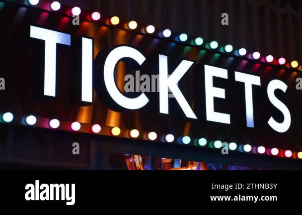 Amusement park - tickets glow sign at carnival, illuminated in night ...