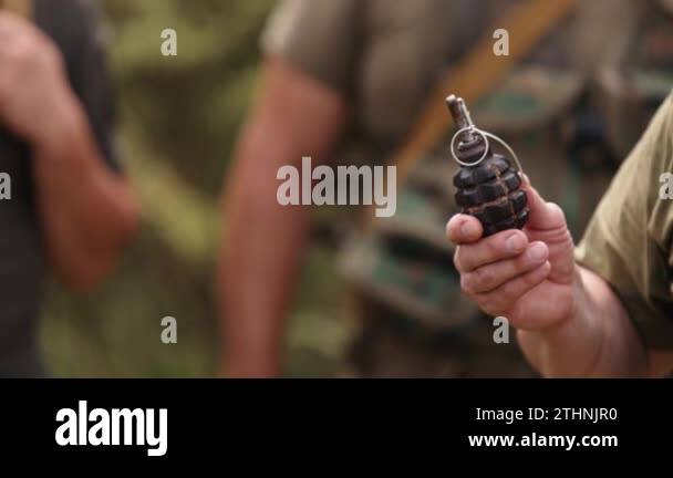 Hand grenade in soldiers hand, realistic hand grenade, smoke grenade ...