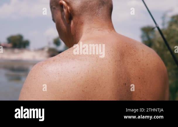 Tanned Shoulders, Back of a Bald Male Standing on the River Bank on ...