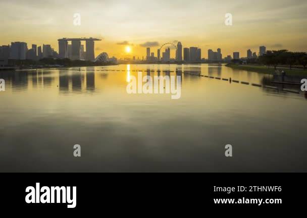 Dramatic sunset scene at Marina Bay Singapore horizon city skyline. 4k ...