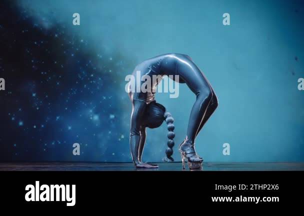 Flexible Woman Contortionist Wearing Shiny Outfit and High Heels ...