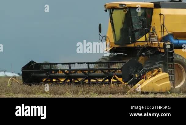Agriculture tractor harvests soybean field in 4K Stock Video Footage ...