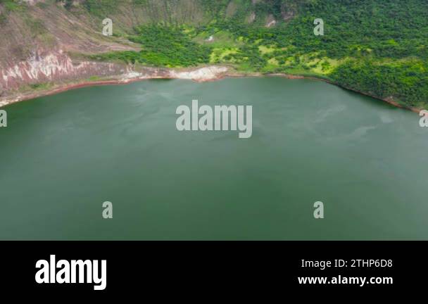 The smallest volcano in the Philippines is Taal with a green crater ...