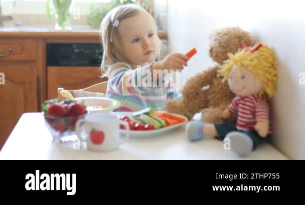 Child girl feeding her doll Stock Videos & Footage - HD and 4K Video ...
