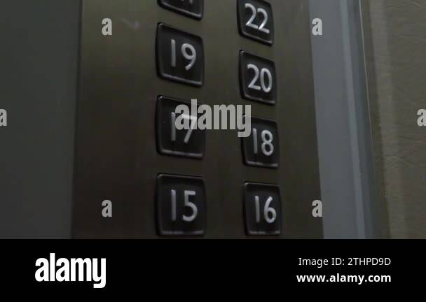 Pushing Elevator Button. Hand pressing lift button up to high floor of ...