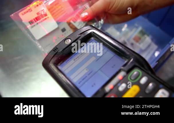 Warehouse worker handles goods scanning with portable data terminal ...