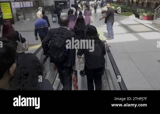 Delhi, India, April 2023: People inside the grand lobby of arrival area ...
