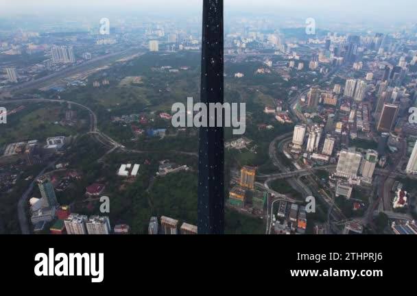 This footage shows a Merdeka 118 Tower Tip descending by drone in 4K ...